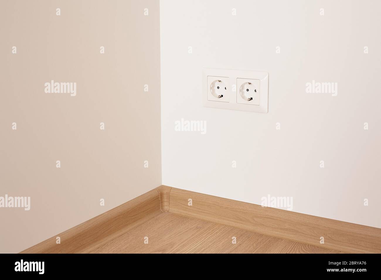 modern power plugs on white wall in apartment Stock Photo - Alamy