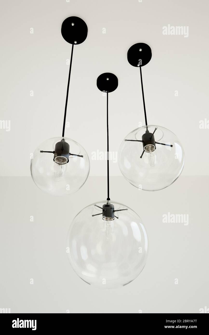 Incandescent light bulbs hanging on ceiling Stock Photo - Alamy