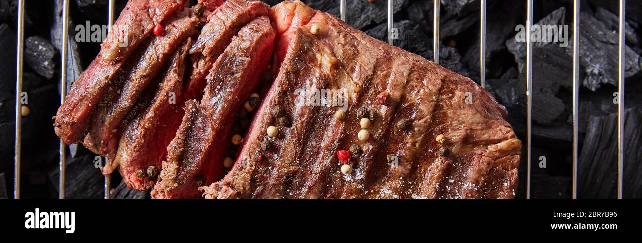 top view of cut fresh grilled tasty steak with rare roasting and ...