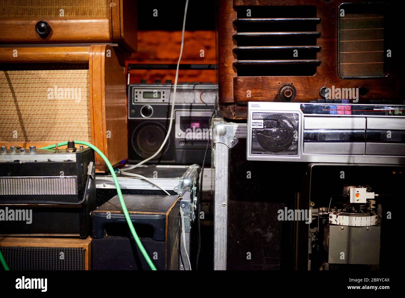 Tower built from old retro vintage disused analog radios, amplifiers ...