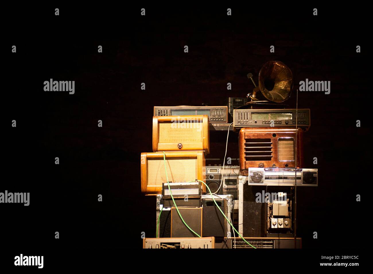 Tower built from old retro vintage disused analog radios, amplifiers ...