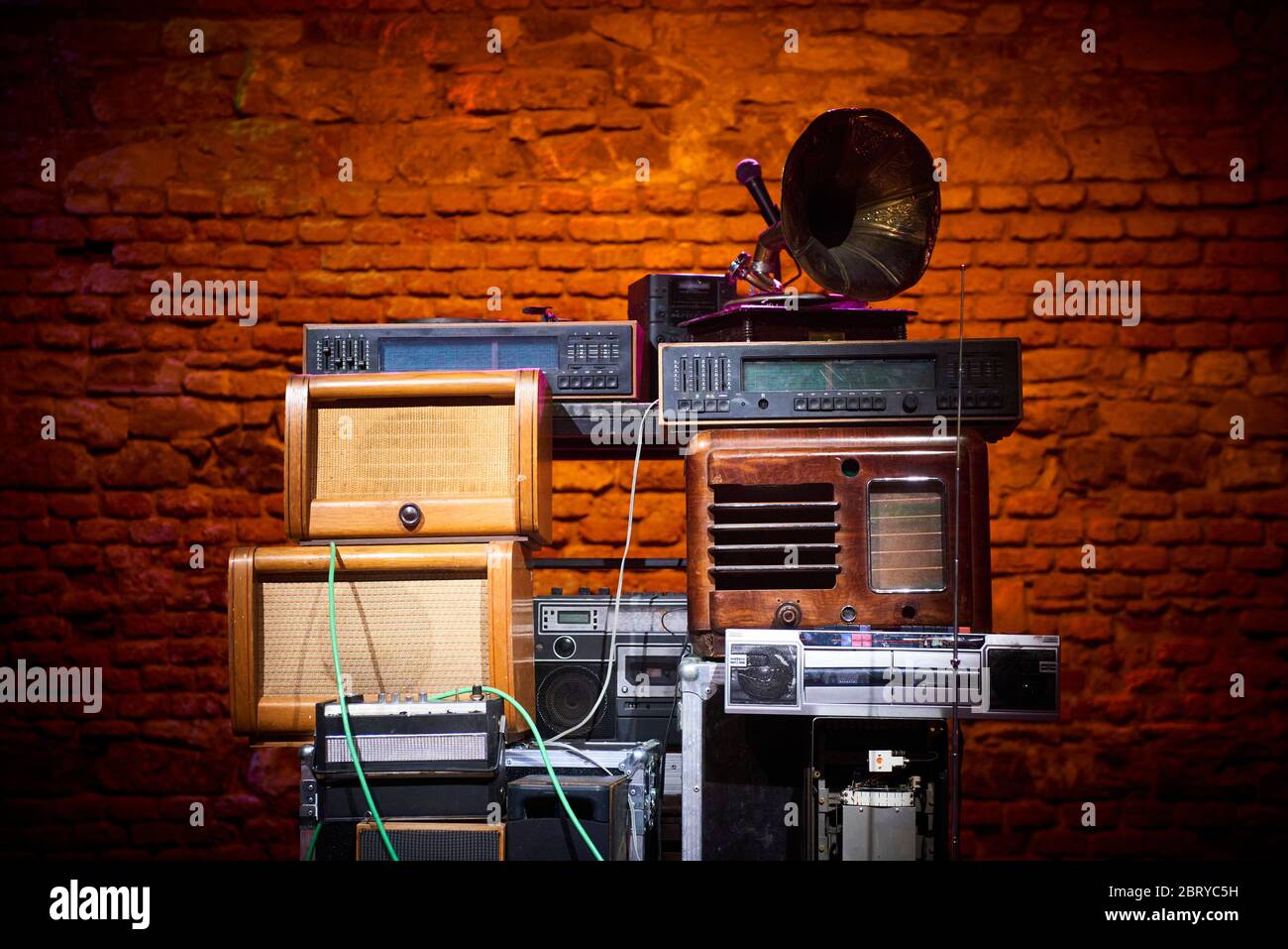 Tower built from old retro vintage disused analog radios, amplifiers ...