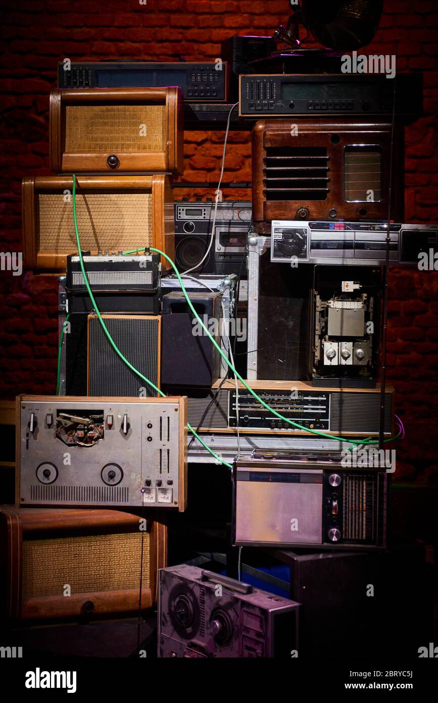 Tower built from old retro vintage disused analog radios, amplifiers ...