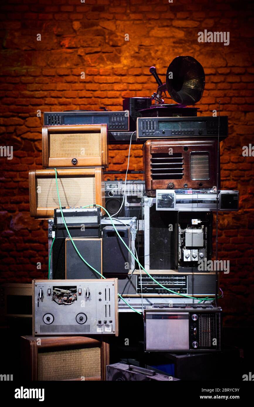 Tower built from old retro vintage disused analog radios, amplifiers ...