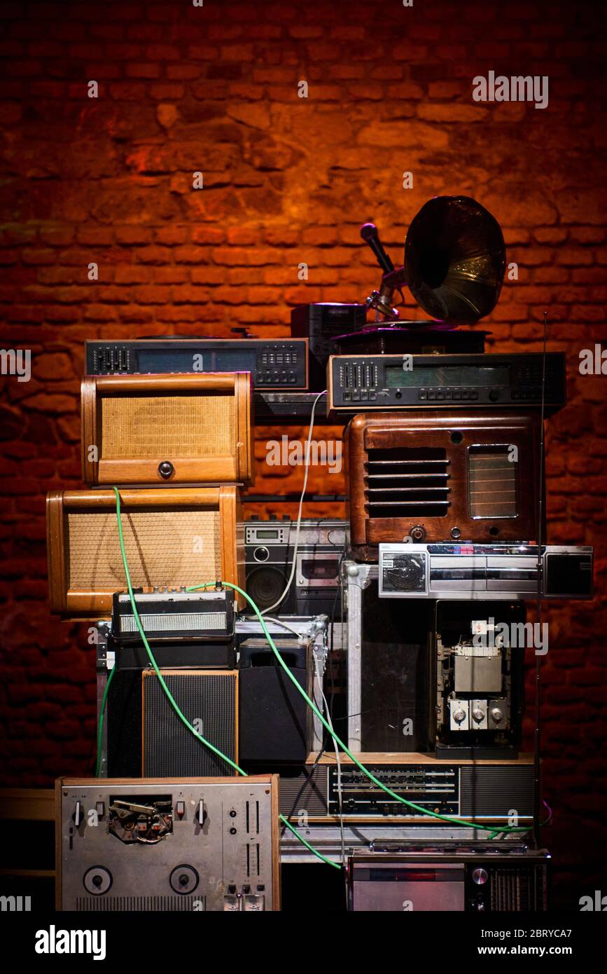 Tower built from old retro vintage disused analog radios, amplifiers ...