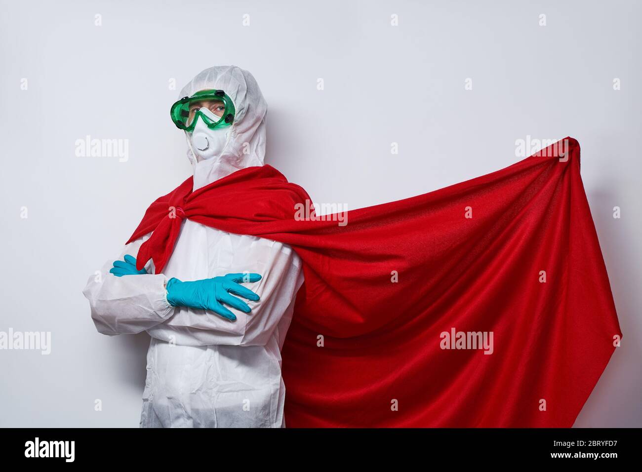 Doctor is wearing PPE - costume, gloves and surgical face mask in ...