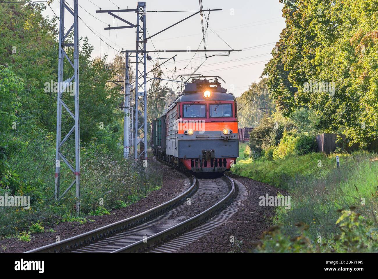 Freight train moves at evening summer time. Russia Stock Photo - Alamy