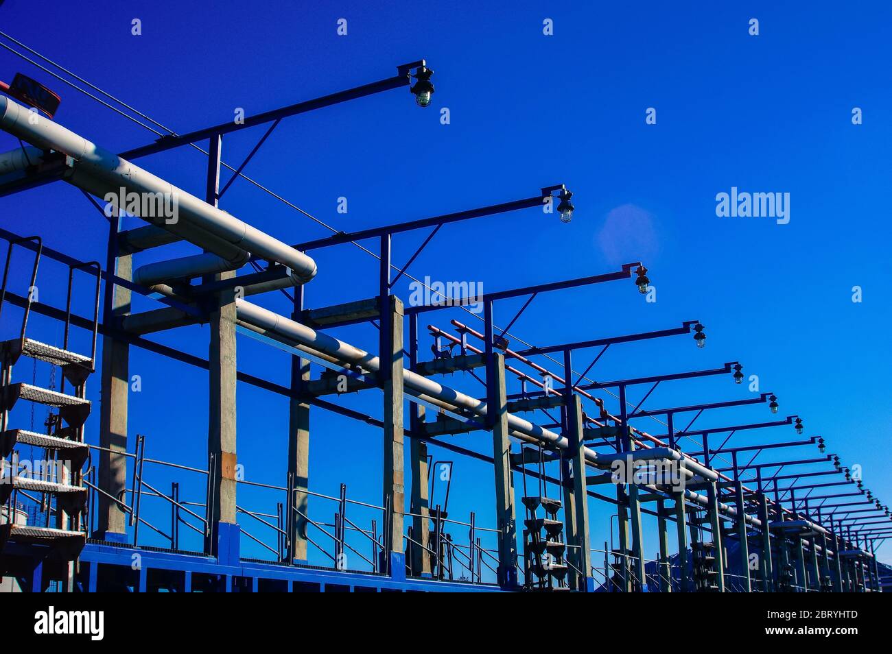 The equipment of oil refining. Industrial zone. Factory equipment ...