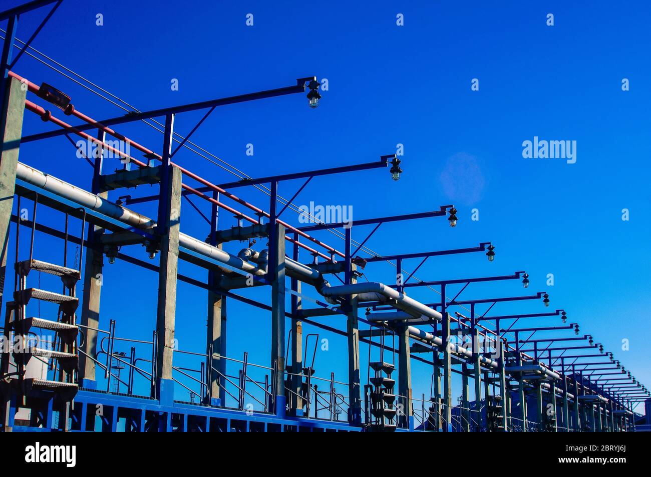 The equipment of oil refining. Industrial zone. Factory equipment ...
