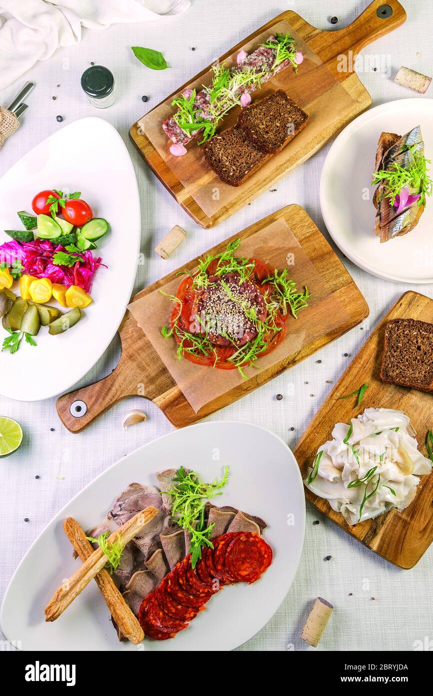 Catering, a lot of cold snacks on table Stock Photo - Alamy