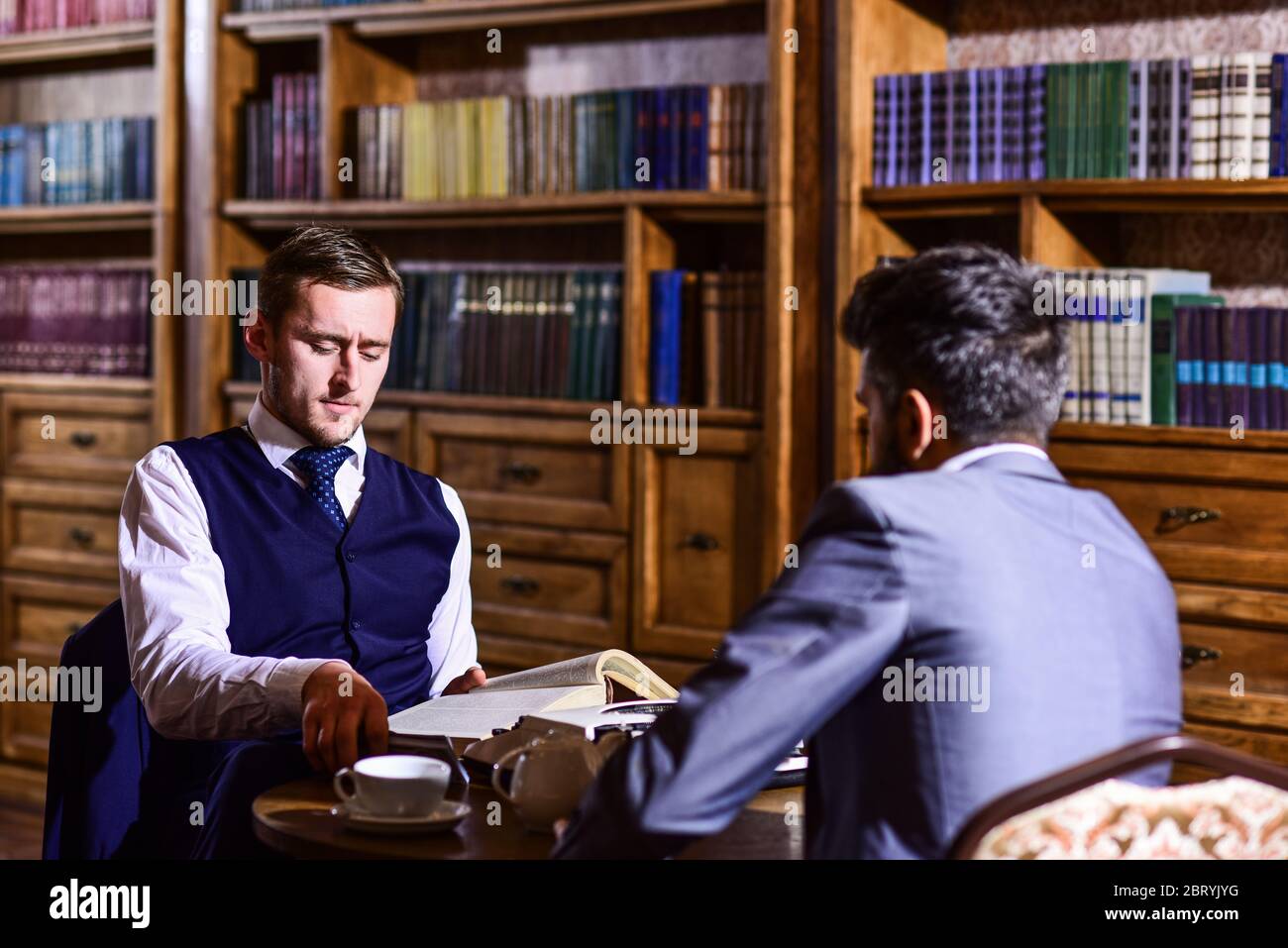 Professors speaking or discuss education in vintage interior ...