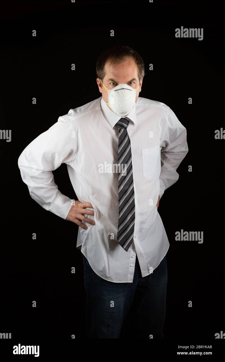 Man ready for work wearing a face mask Stock Photo - Alamy