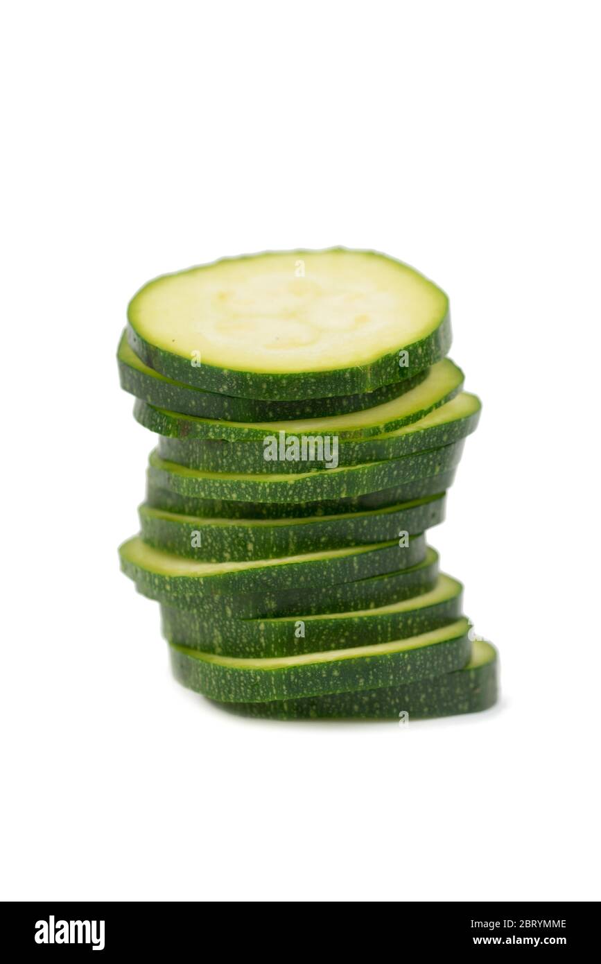 green courgette cut in many slices Stock Photo - Alamy