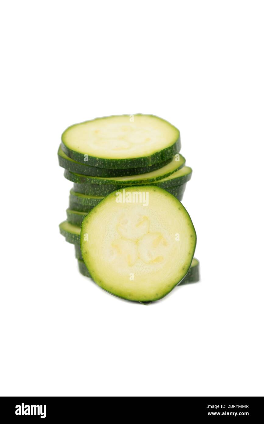 green courgette cut in many slices Stock Photo - Alamy