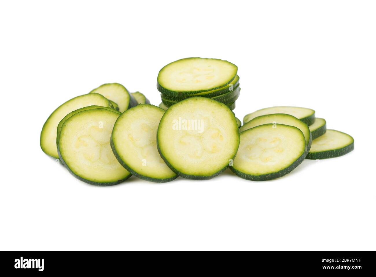 green courgette cut in many slices Stock Photo - Alamy