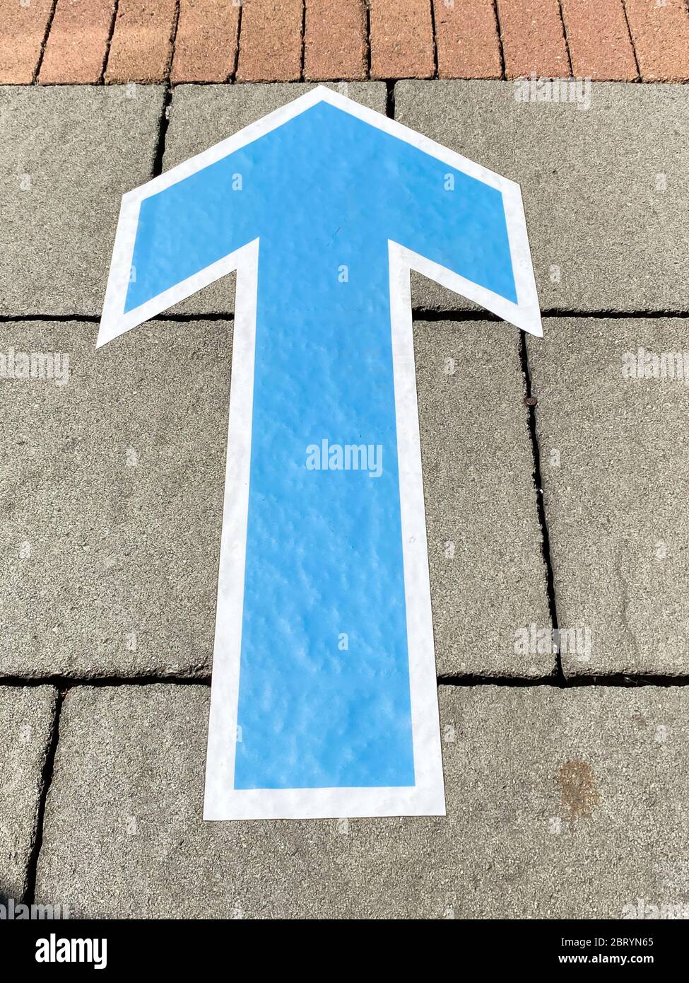Isolated blue arrow on pavement showing direction straight ahead Stock ...