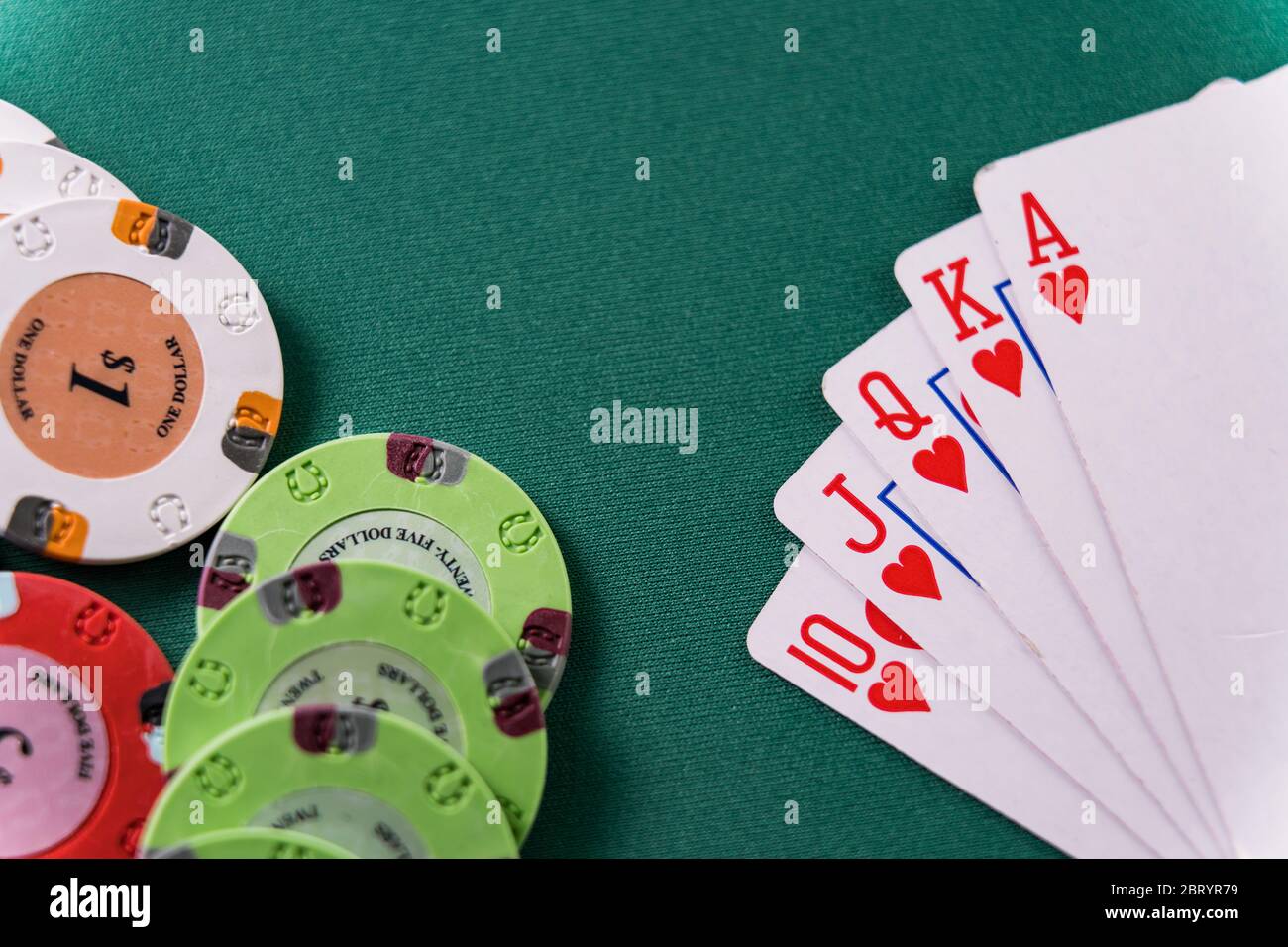 Poker game royal flush with chips Stock Photo - Alamy