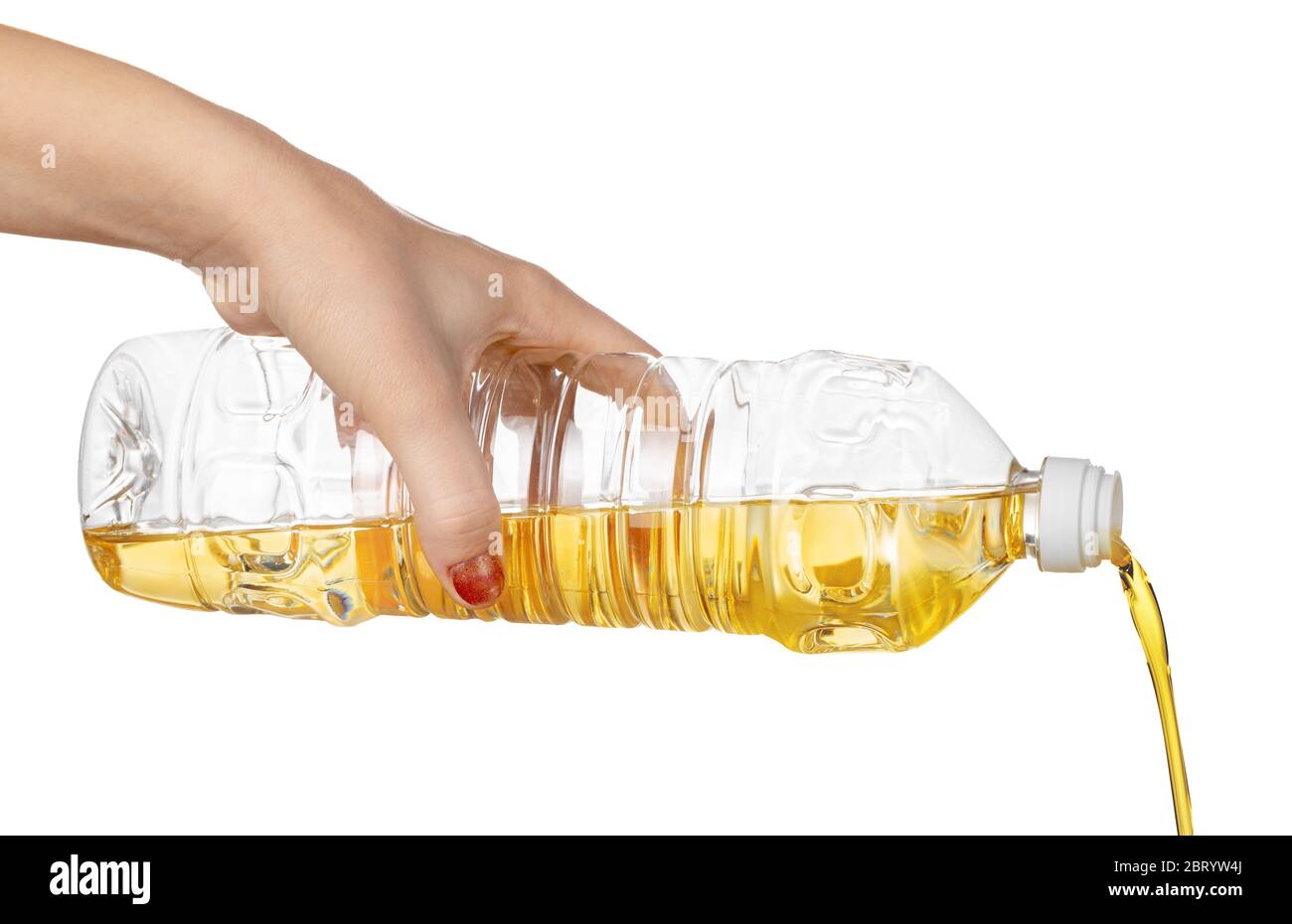 Hand of woman pouring cooking oil from plastic bottle. Isolated on ...