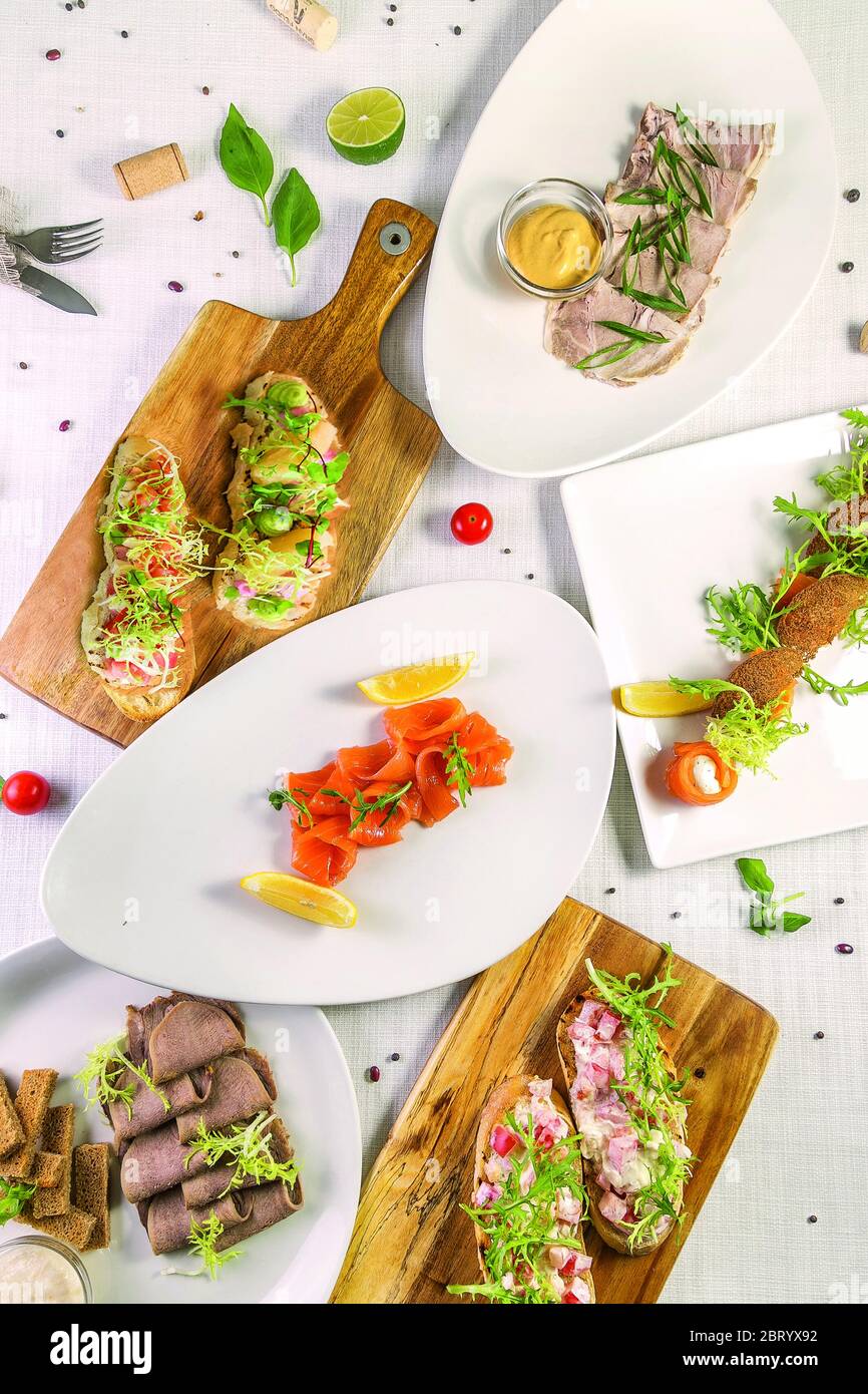 Catering, a lot of cold snacks on table Stock Photo - Alamy