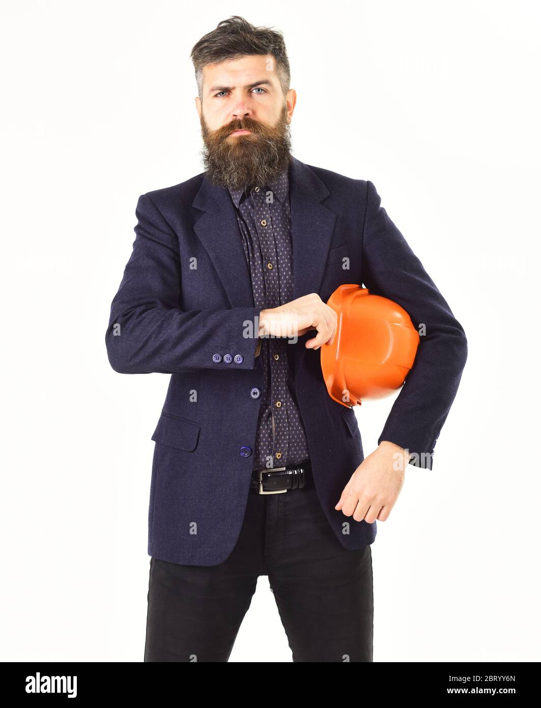 Architect wears construction helmet. Architect with long beard and ...