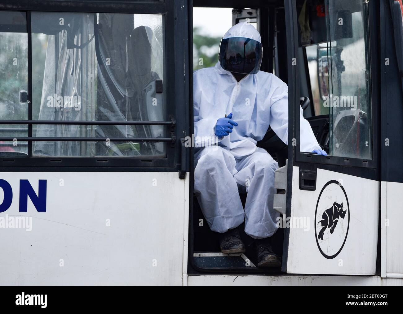 Guwahati, Assam, India. 22nd May, 2020. A bus driver wearing PPE kit at ...
