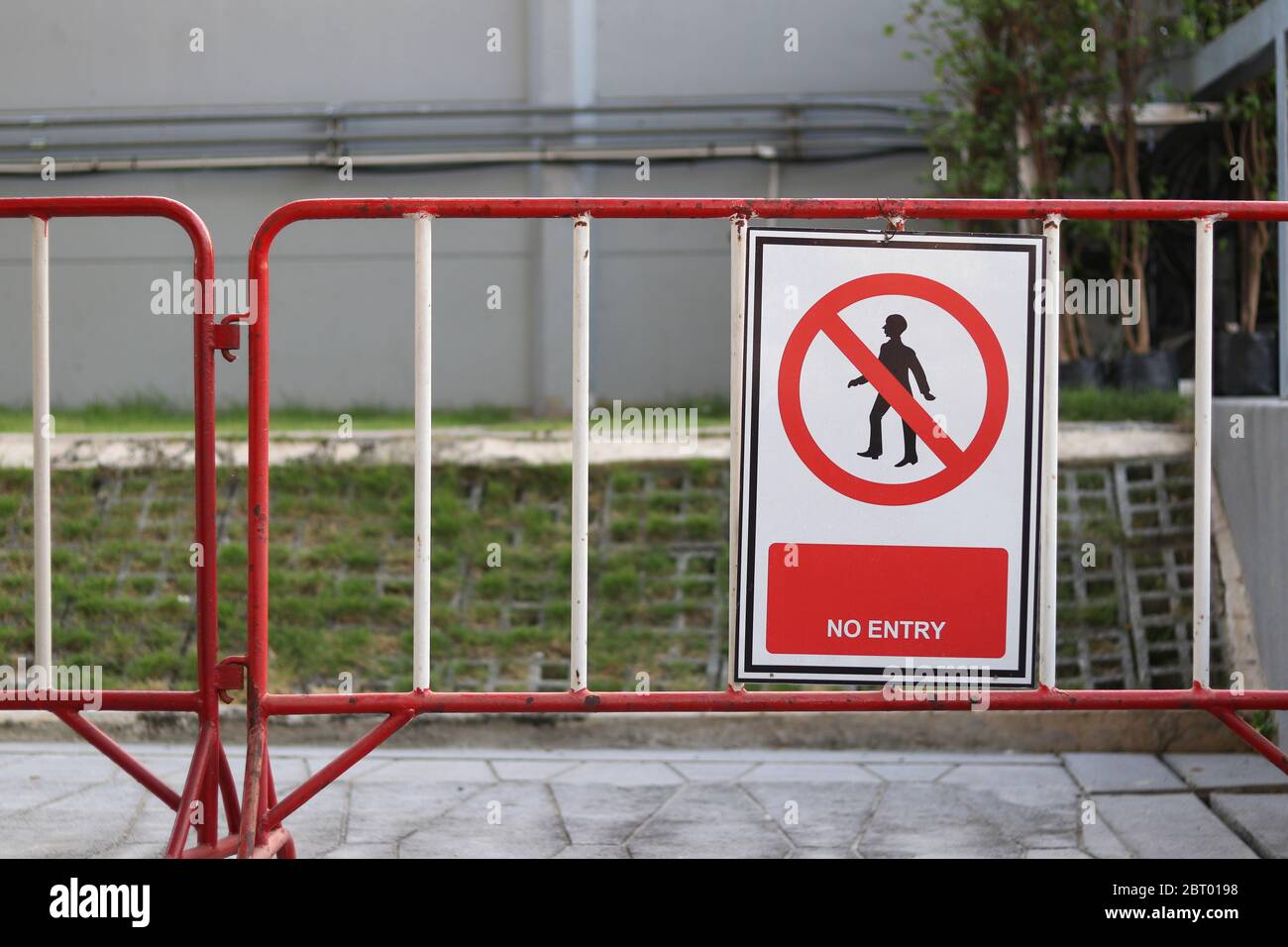 A sign strictly prohibiting this route. No entry sign hanging on iron ...