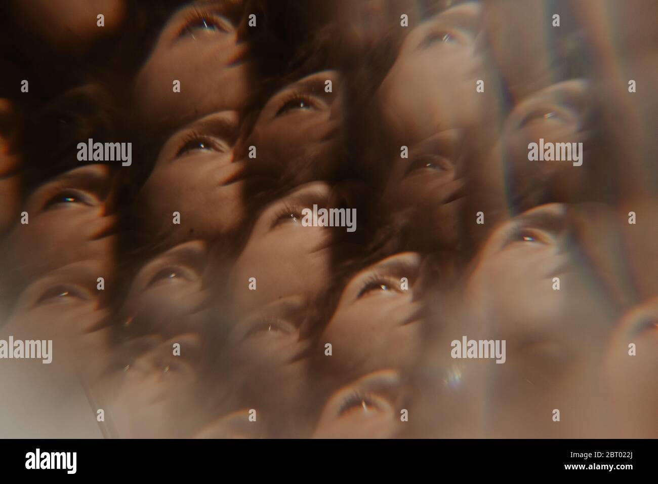 Multifaceted reflection of a woman's face in a window Stock Photo - Alamy