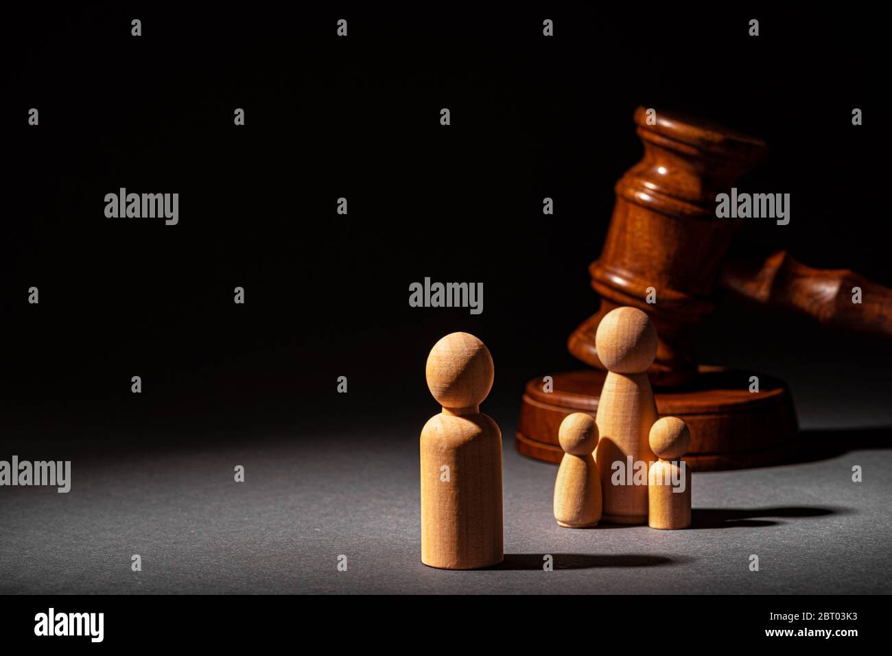 Wooden toy family and judge mallet. Family divorce concept Stock Photo ...
