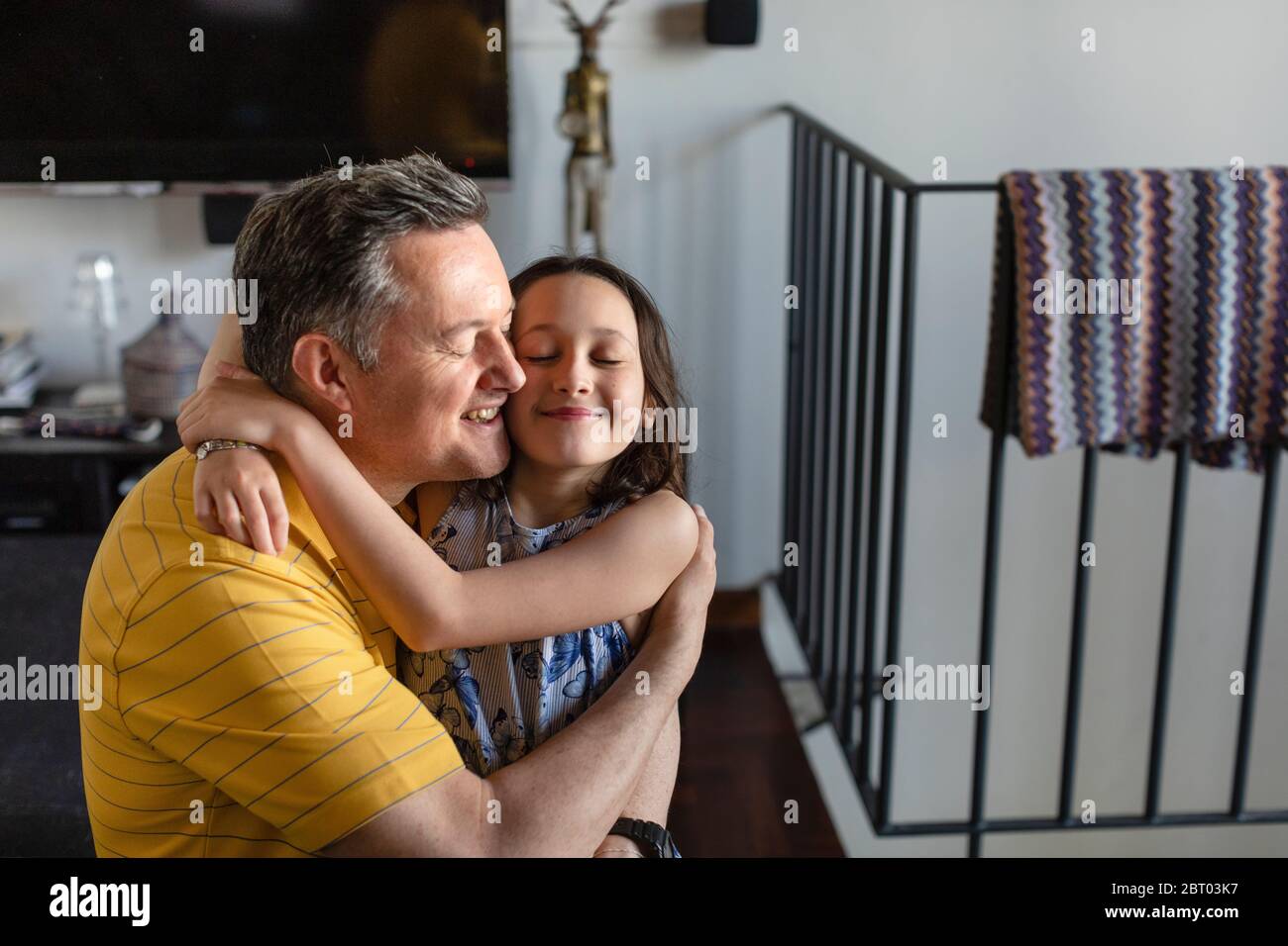 Father hugging his daughter, at home during lockdown Stock Photo - Alamy