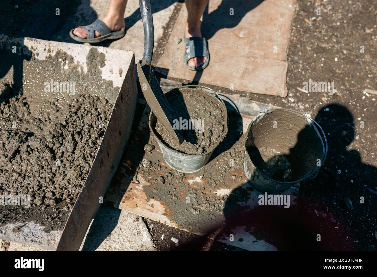 Work with cement mortar, pouring cement mortar wall, foundation and ...