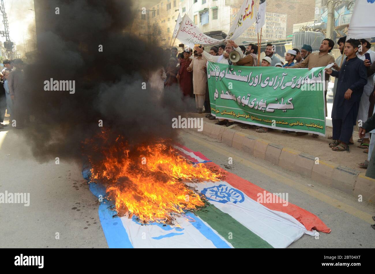 Peshawar, Pakistan. 22nd May, 2020. People chant slogans as they set on ...