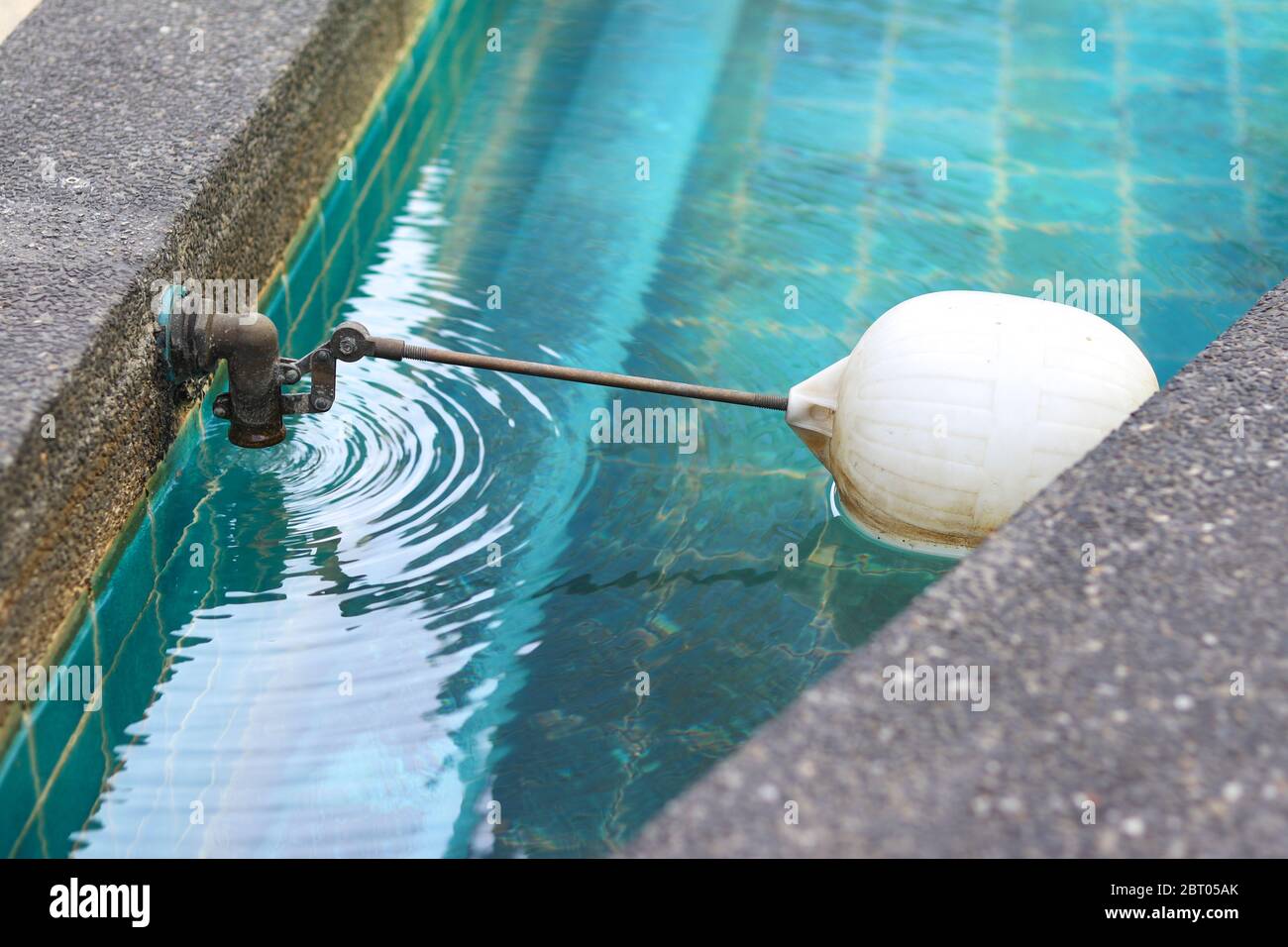 Float ball valve for filling water into the pool Stock Photo - Alamy