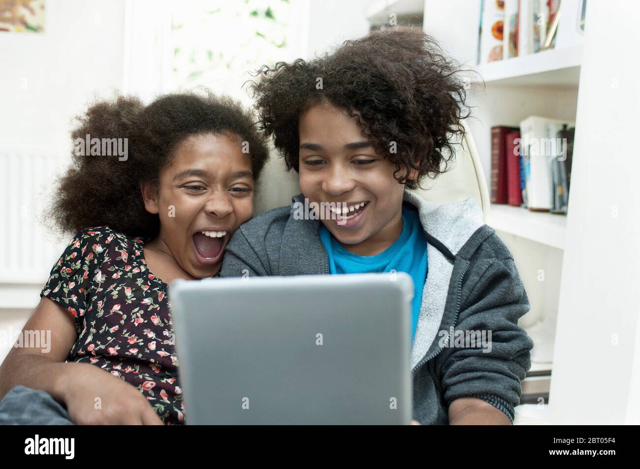 Laughing boys laptop hi-res stock photography and images - Alamy