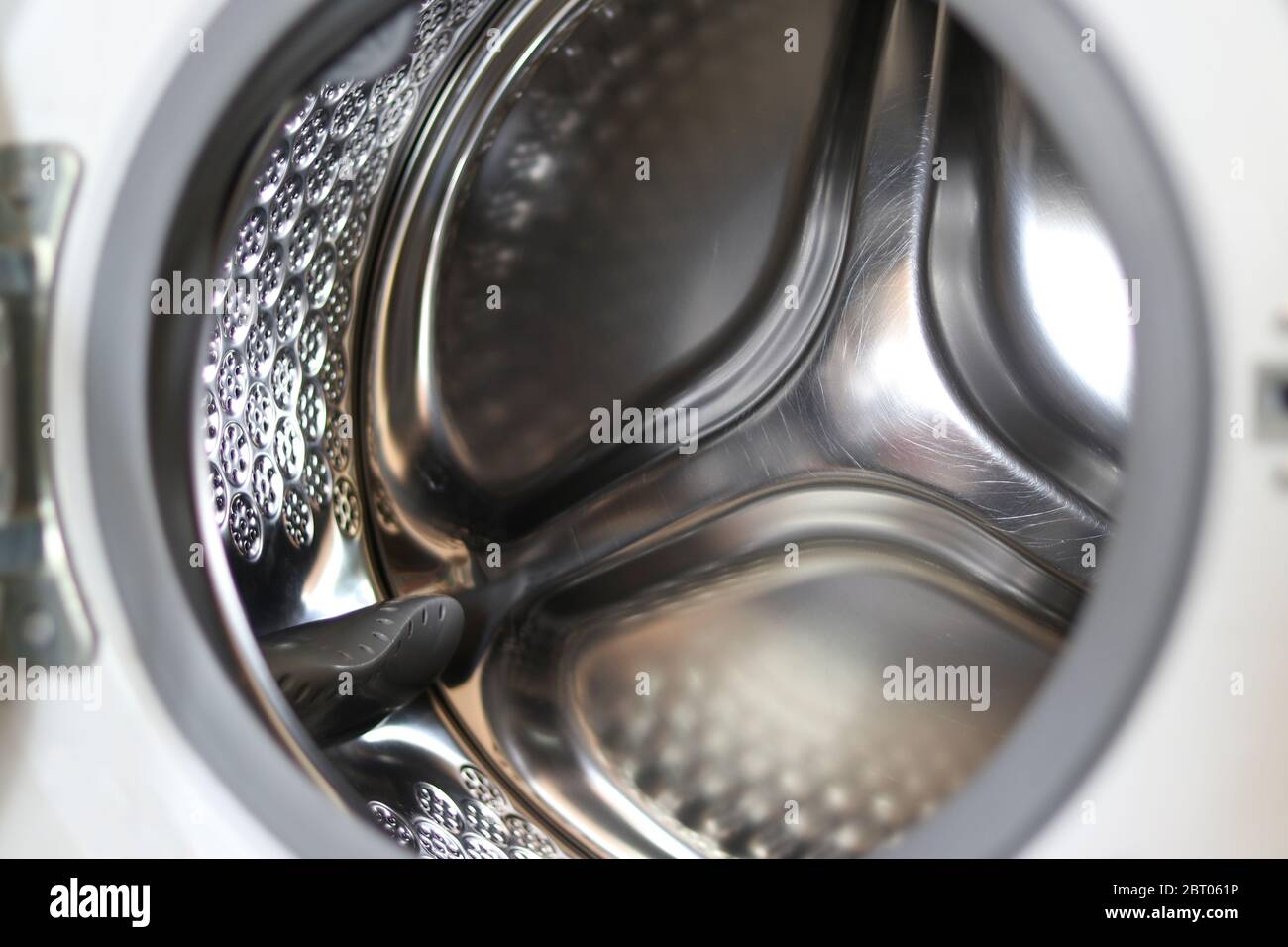 The inside of the front load washing machine is a stainless steel ...