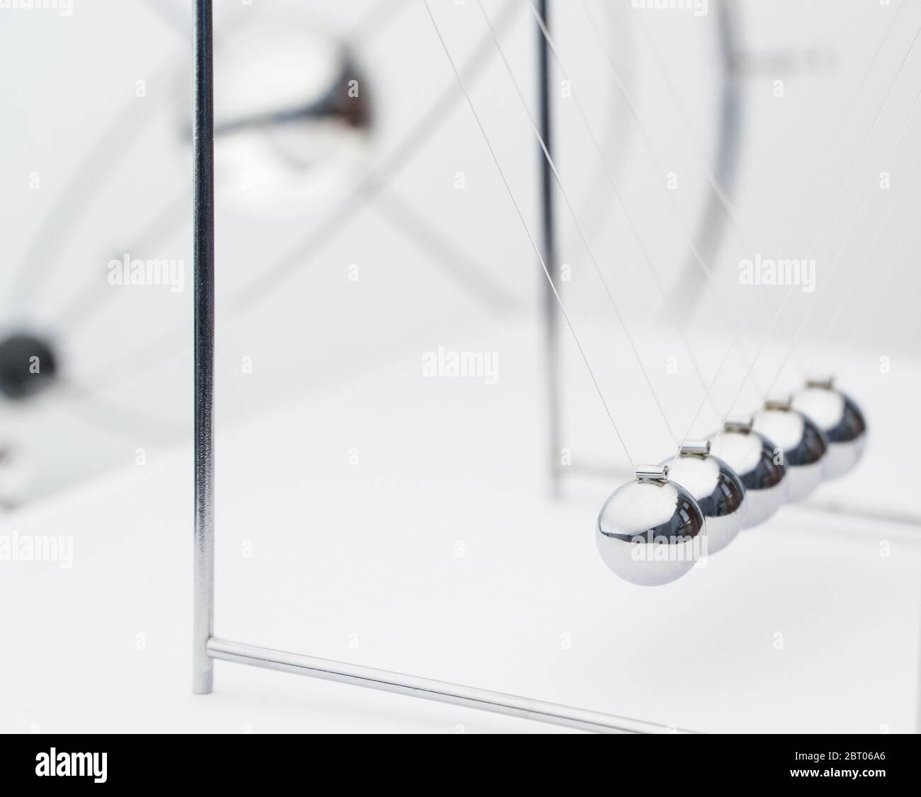 balancing balls on a white background. business concept. Newtons Cradle ...