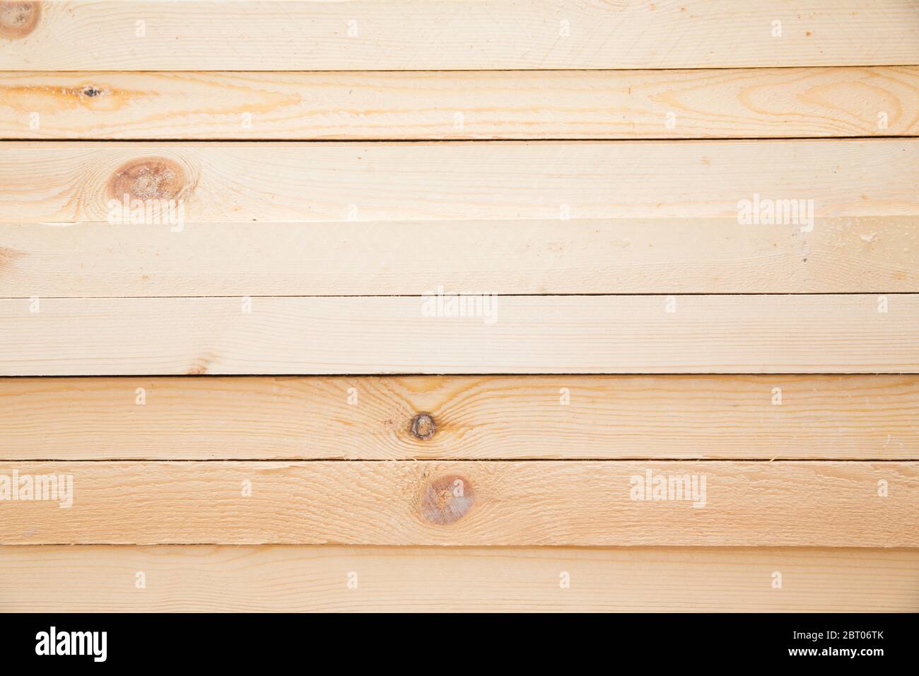 Timber industry objects. Finished wood beams or plank at a warehouse ...