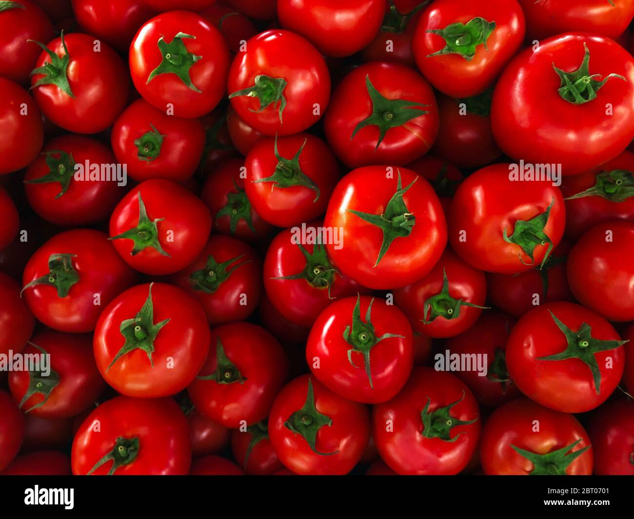 Stack of tomatoes background texture Stock Photo - Alamy