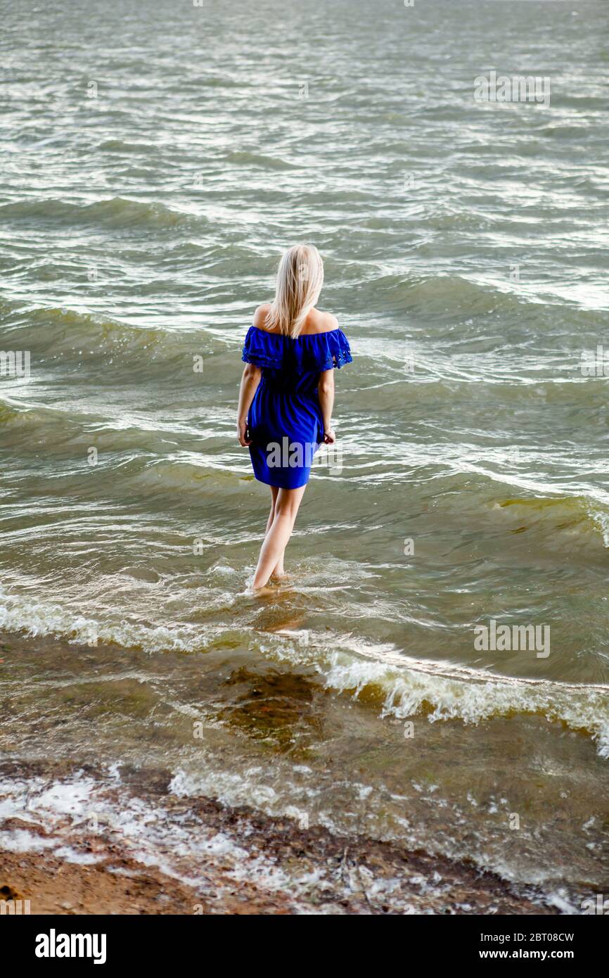 girl went ankle-deep in the sea Stock Photo - Alamy