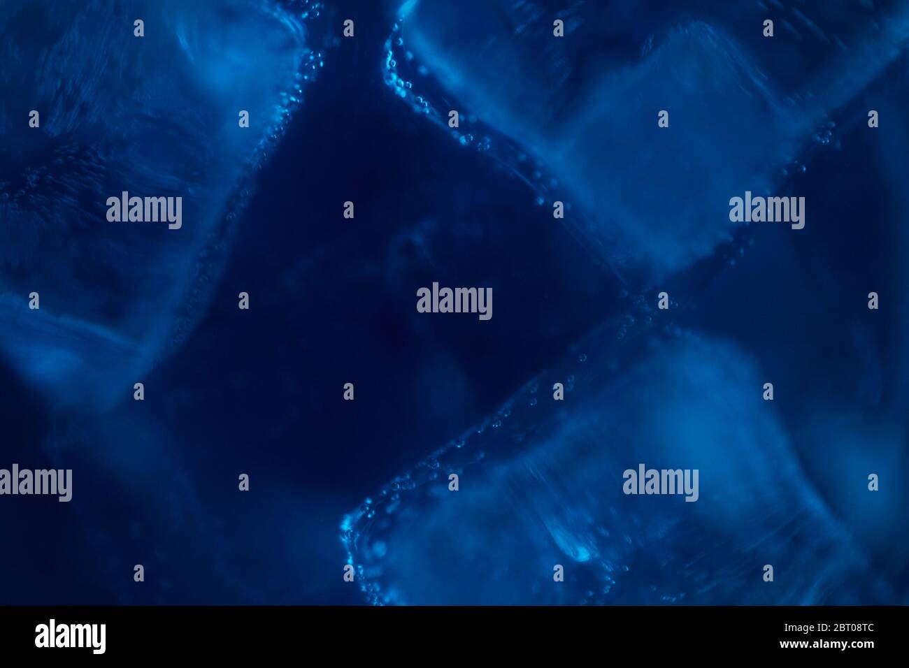 Blue sparkling water with ice cubes and bubbles macro close up Stock ...