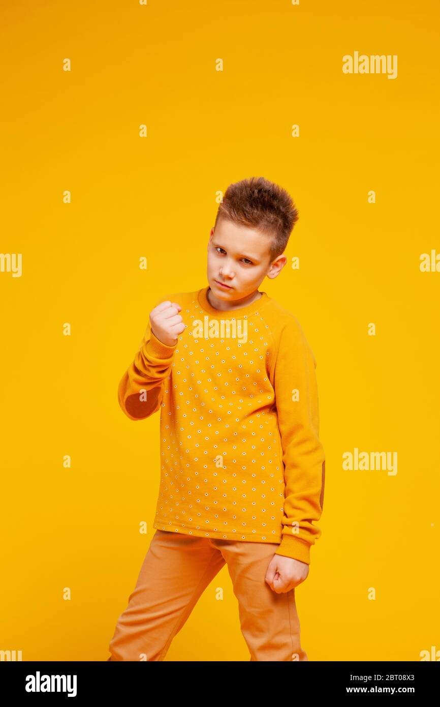 angry teen boy shows clenched fist Stock Photo - Alamy