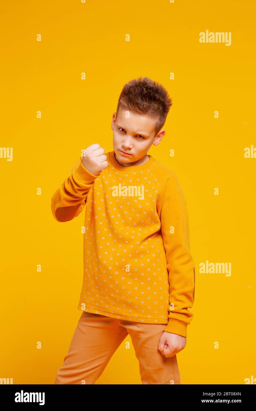 angry boy shows clenched fist Stock Photo - Alamy