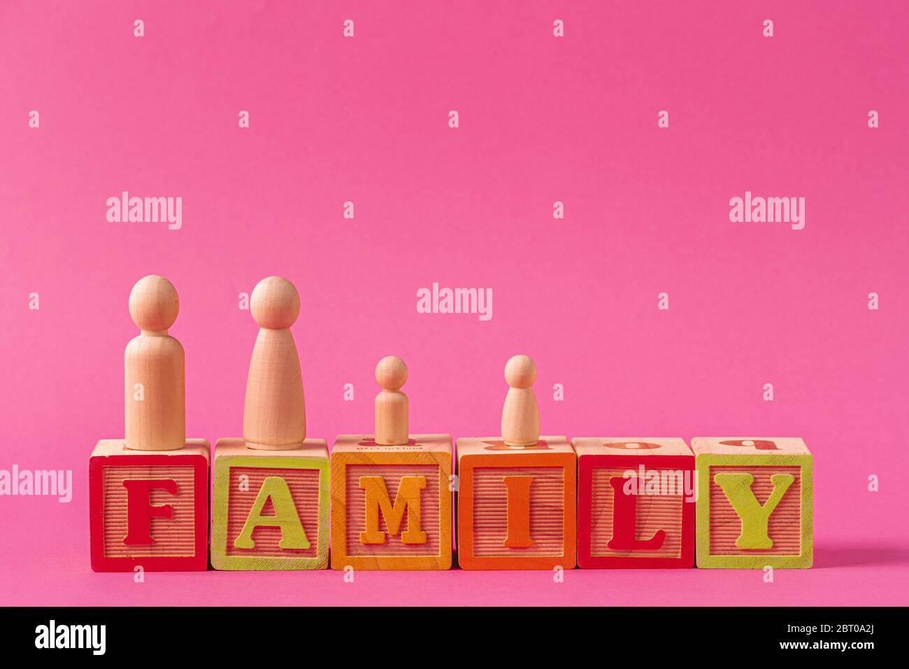 Small wooden figures of family members. Family relationship symbol ...