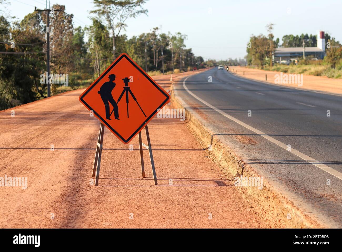 Orange label with pictograms survey engineering inside placed along the ...