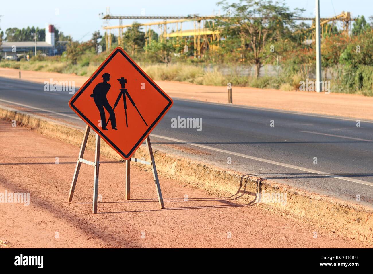 Orange label with pictograms survey engineering inside placed along the ...