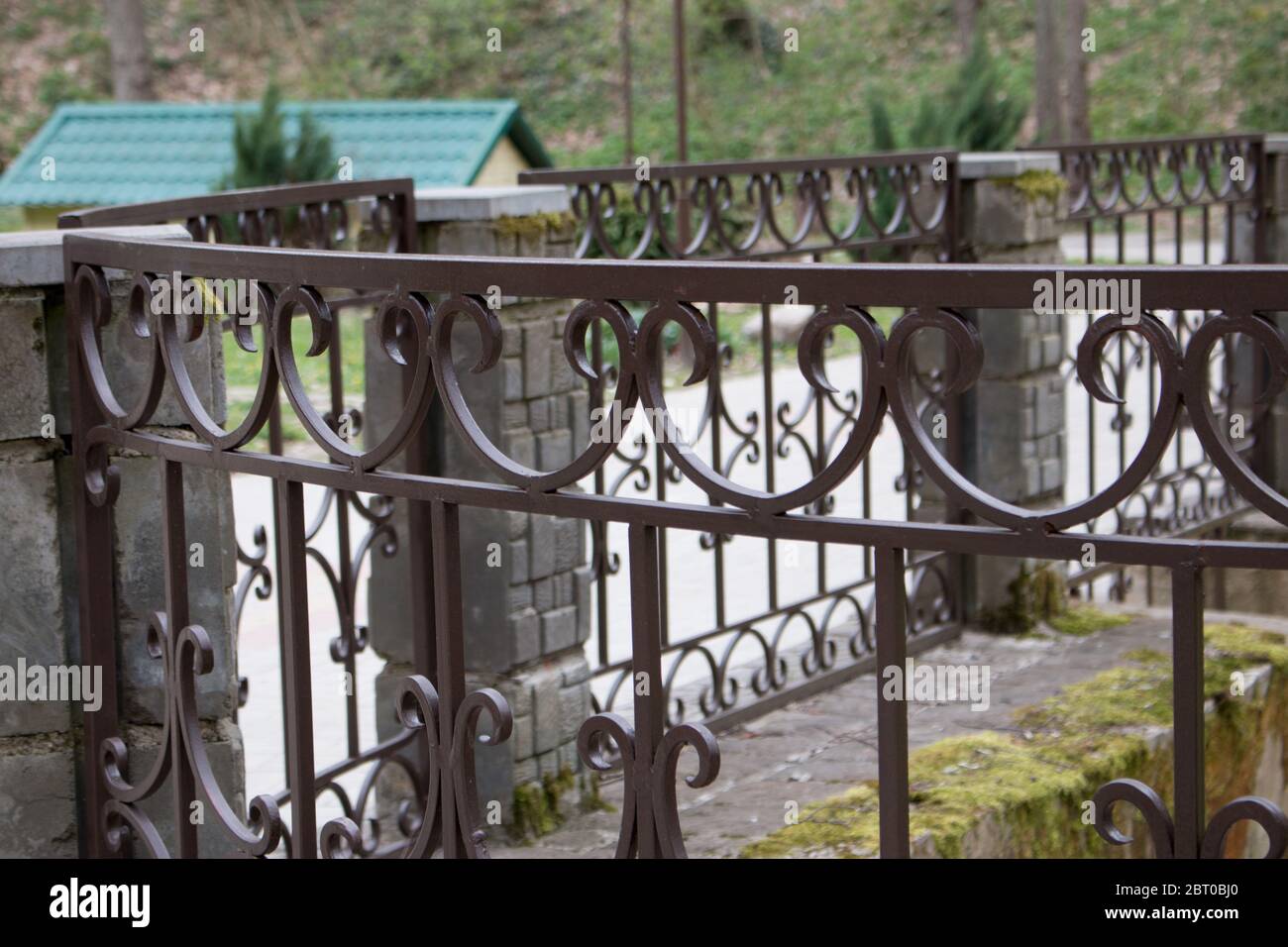 Wrought iron lattice in the park Stock Photo - Alamy