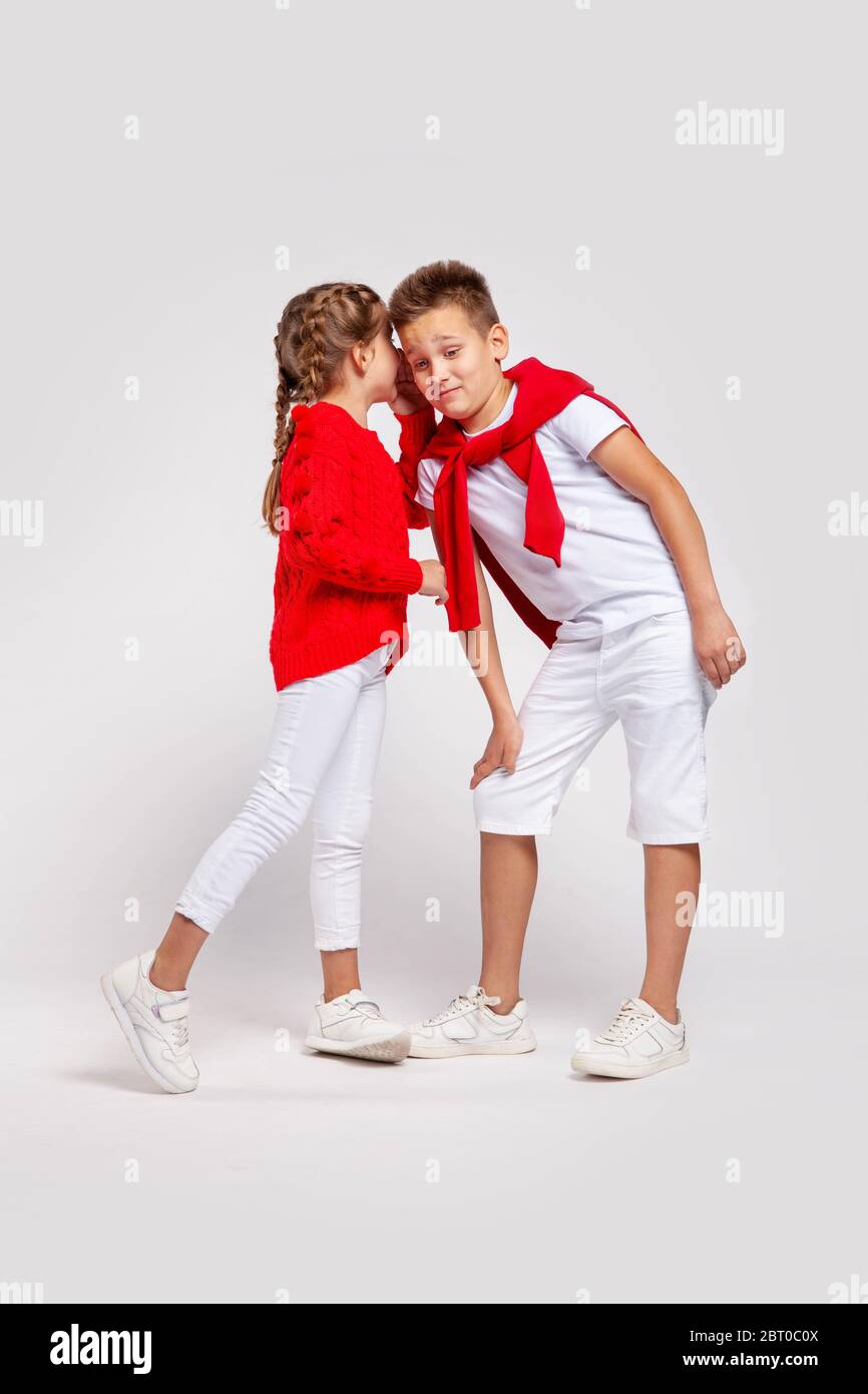 friends are secretive with each other; the boy looks surprised Stock ...