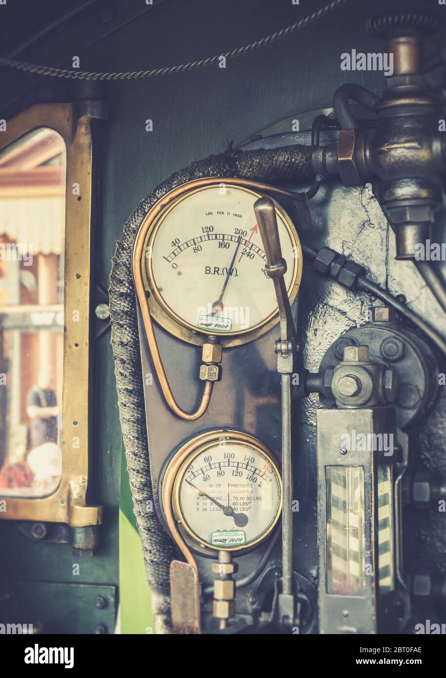 Retro close up of steam engine controls inside steam train driver's ...