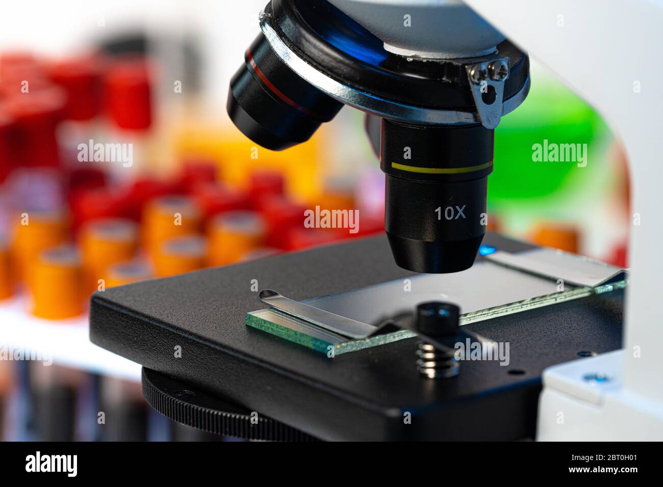 Close up photo of a microscope lenses examining glass sample Stock ...