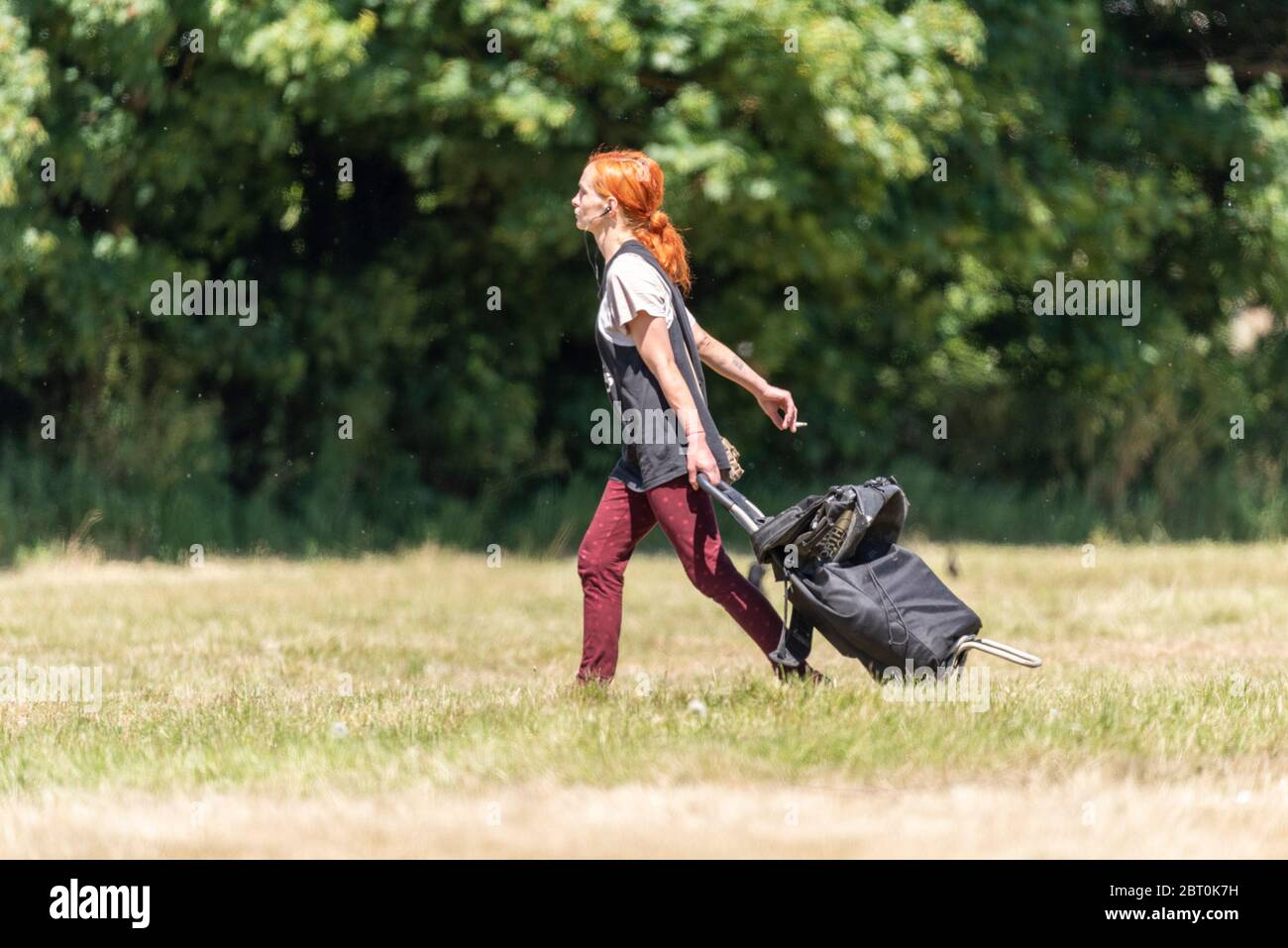 Female with shopping trolley hi-res stock photography and images - Alamy
