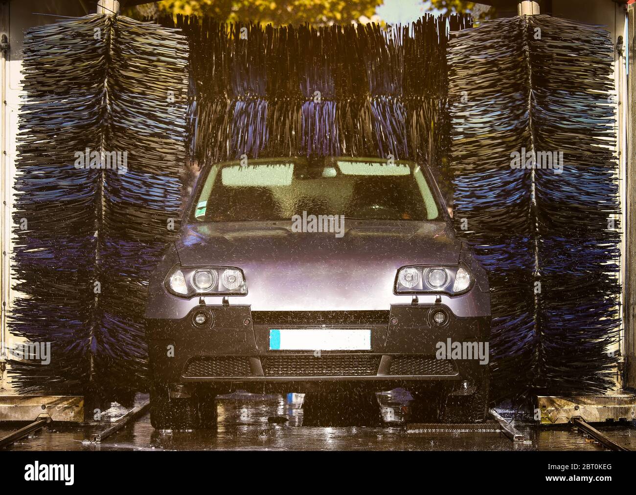 Car wash with water Automatic car wash in action Stock Photo - Alamy